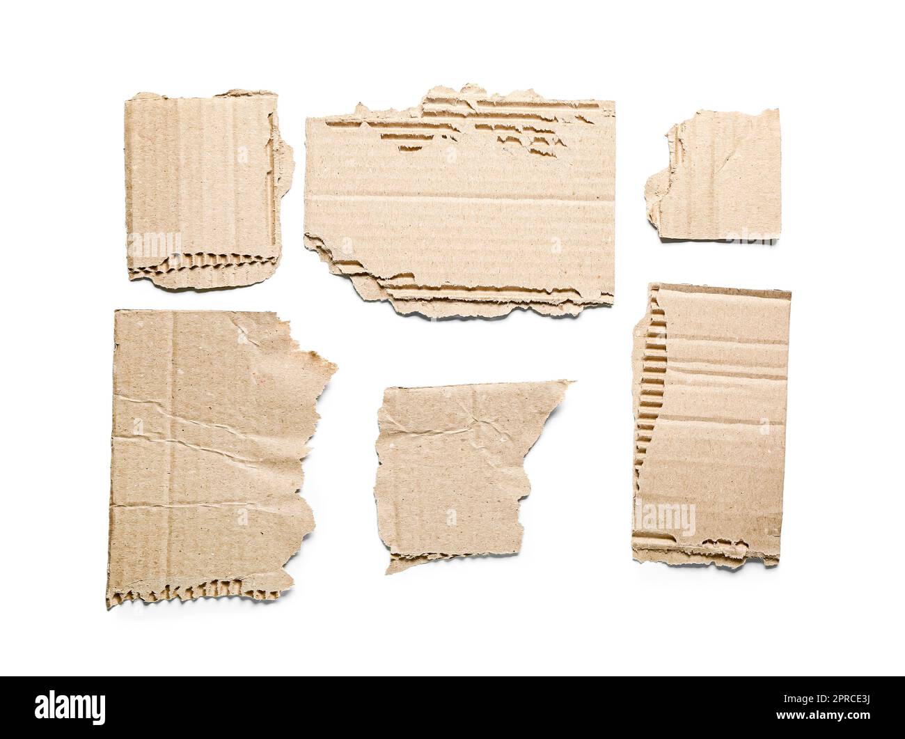Ripped cardboard pieces isolated on white background Stock Photo - Alamy
