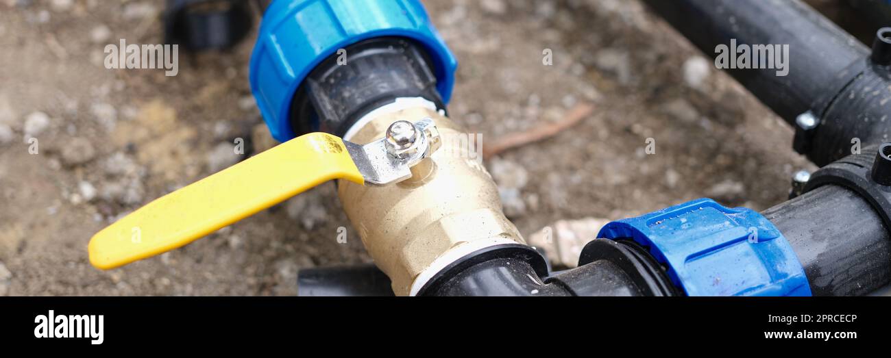 Elbow fitting of pvc pipes at bend with yellow faucet Stock Photo - Alamy