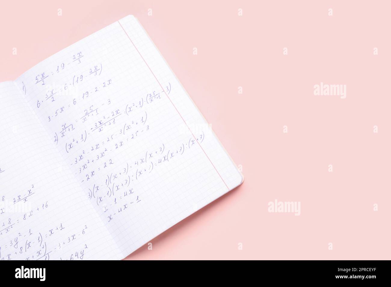Copybook with maths formulas on pink background Stock Photo - Alamy