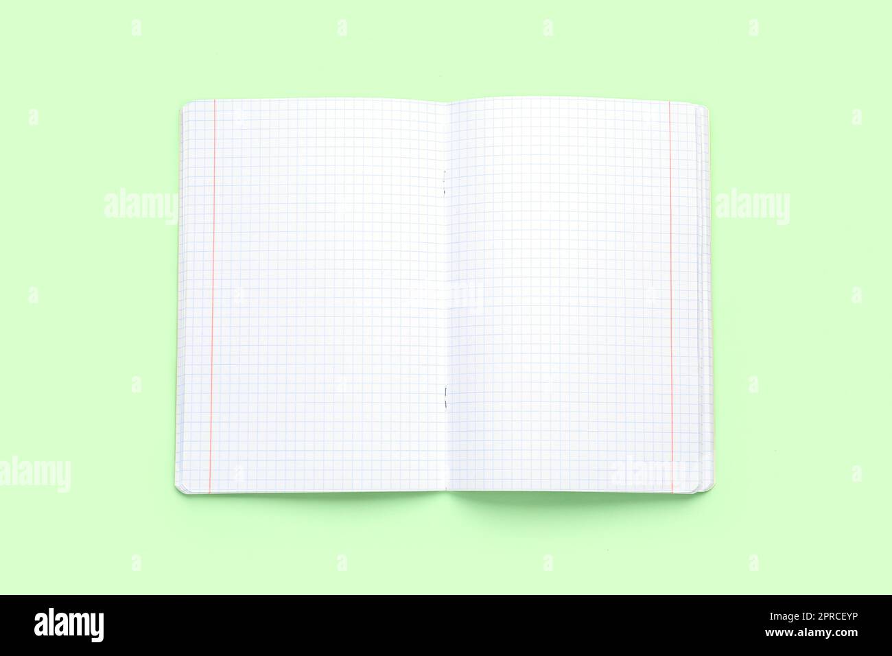 Blank copybook pages on green background Stock Photo - Alamy