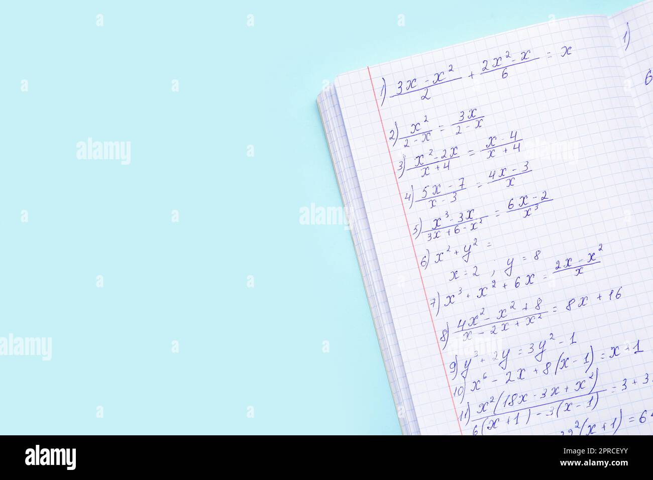 Copybook with maths formulas on blue background Stock Photo - Alamy