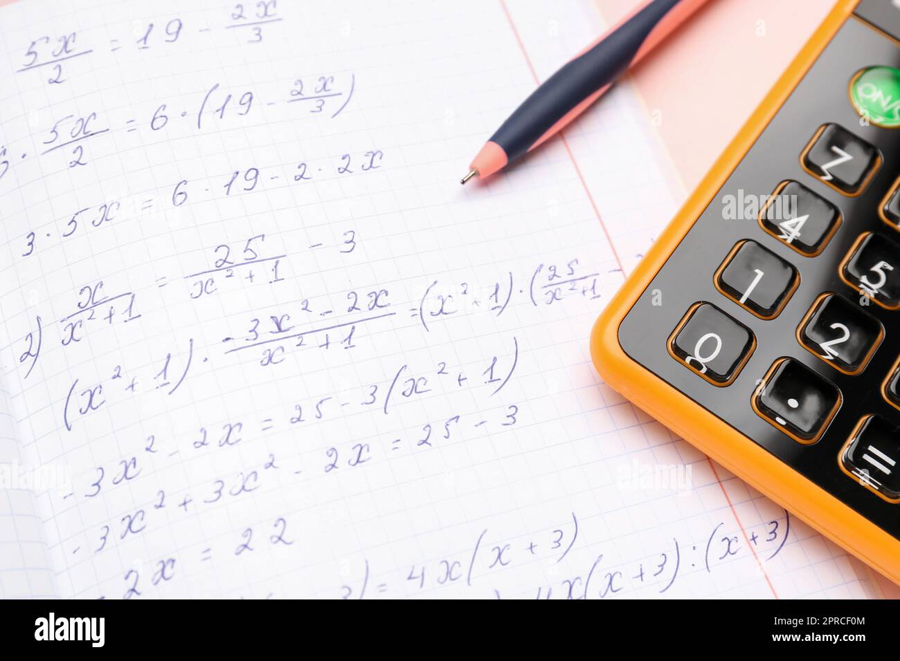 Copybook with maths formulas, pen and calculator, closeup Stock Photo ...