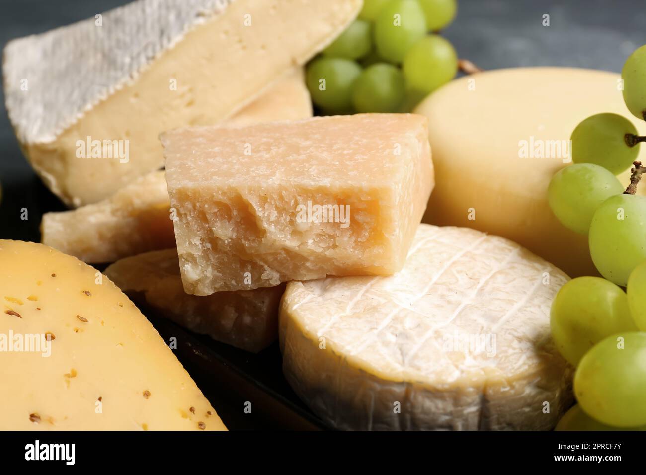 Different types of tasty cheese on table, closeup Stock Photo - Alamy