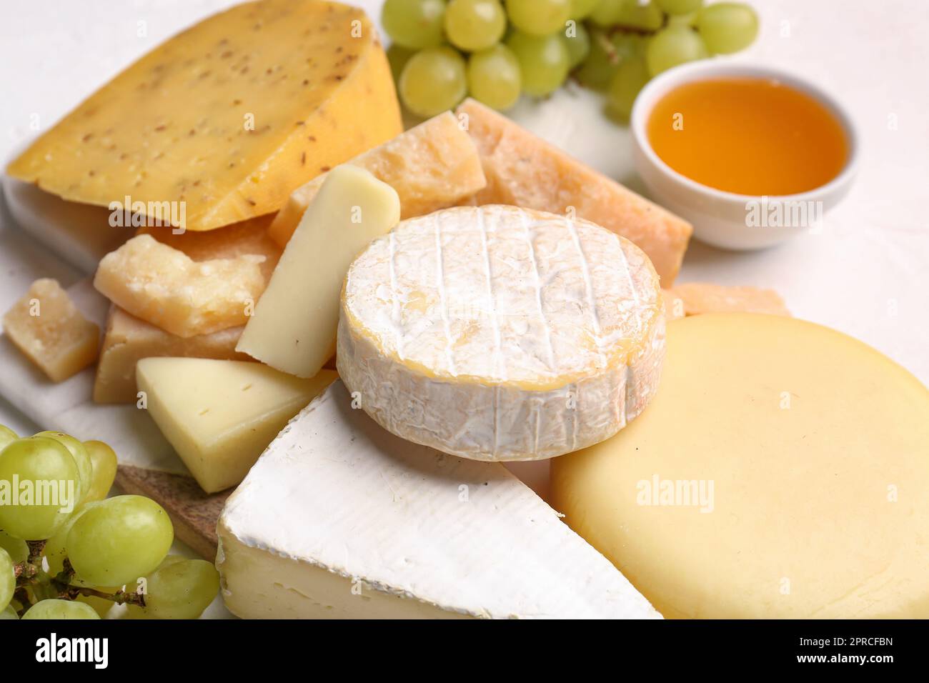 Different types of tasty cheese on table, closeup Stock Photo - Alamy