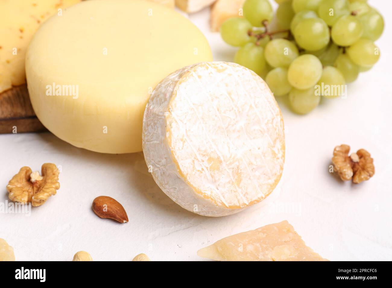 Different types of tasty cheese on light background, closeup Stock ...