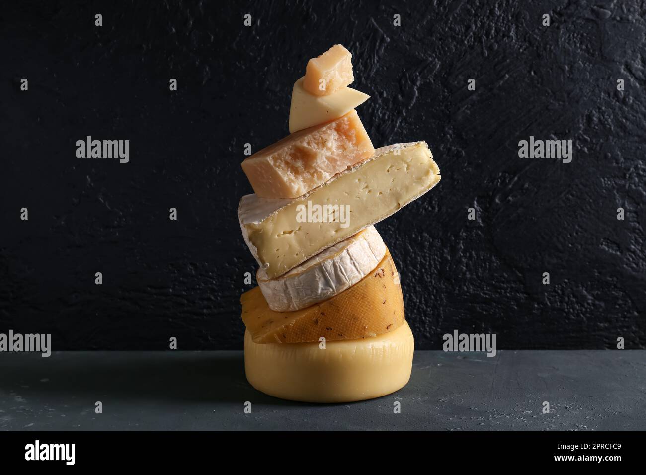 Different types of tasty cheese on table Stock Photo - Alamy