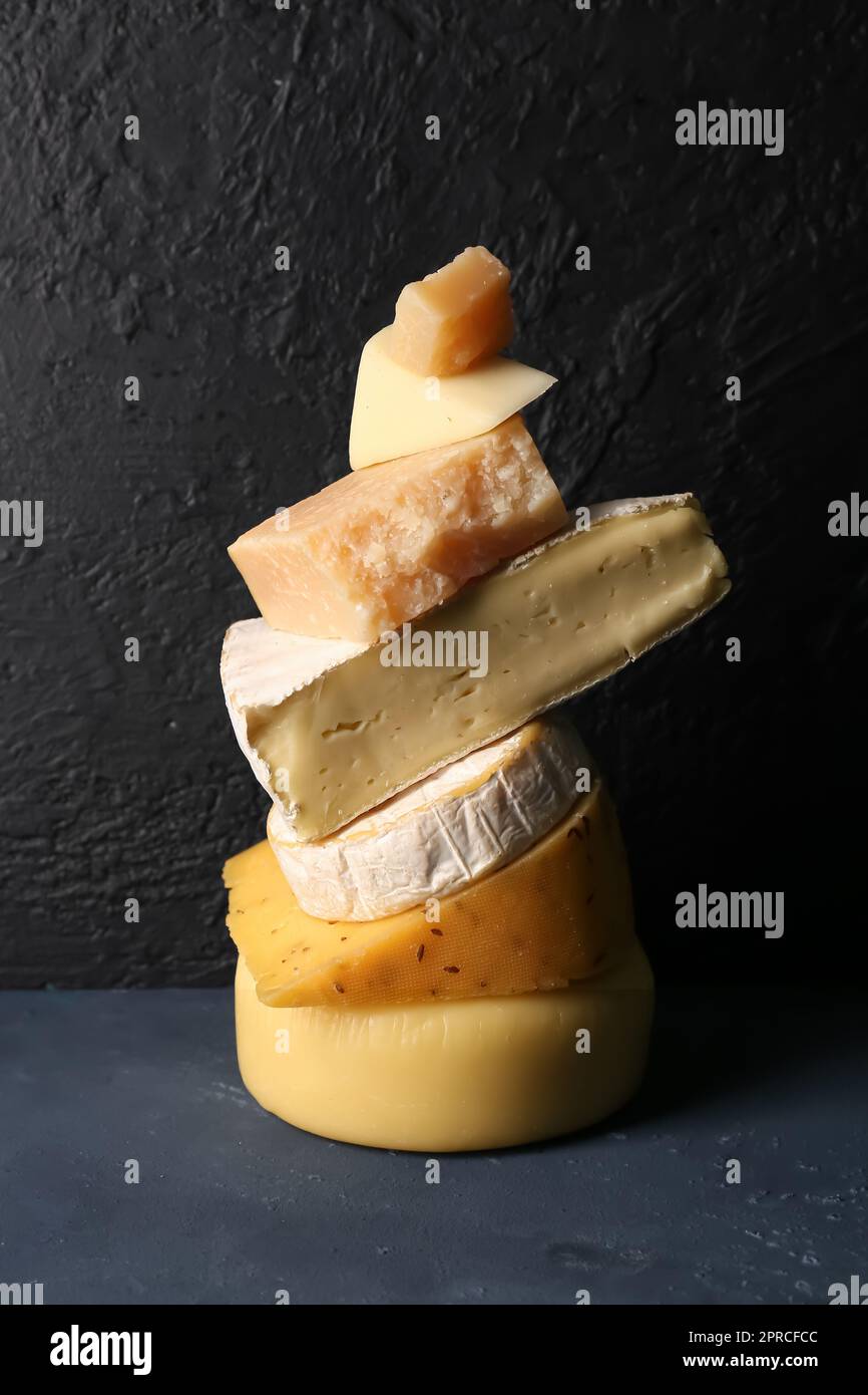 Different types of tasty cheese on table Stock Photo - Alamy