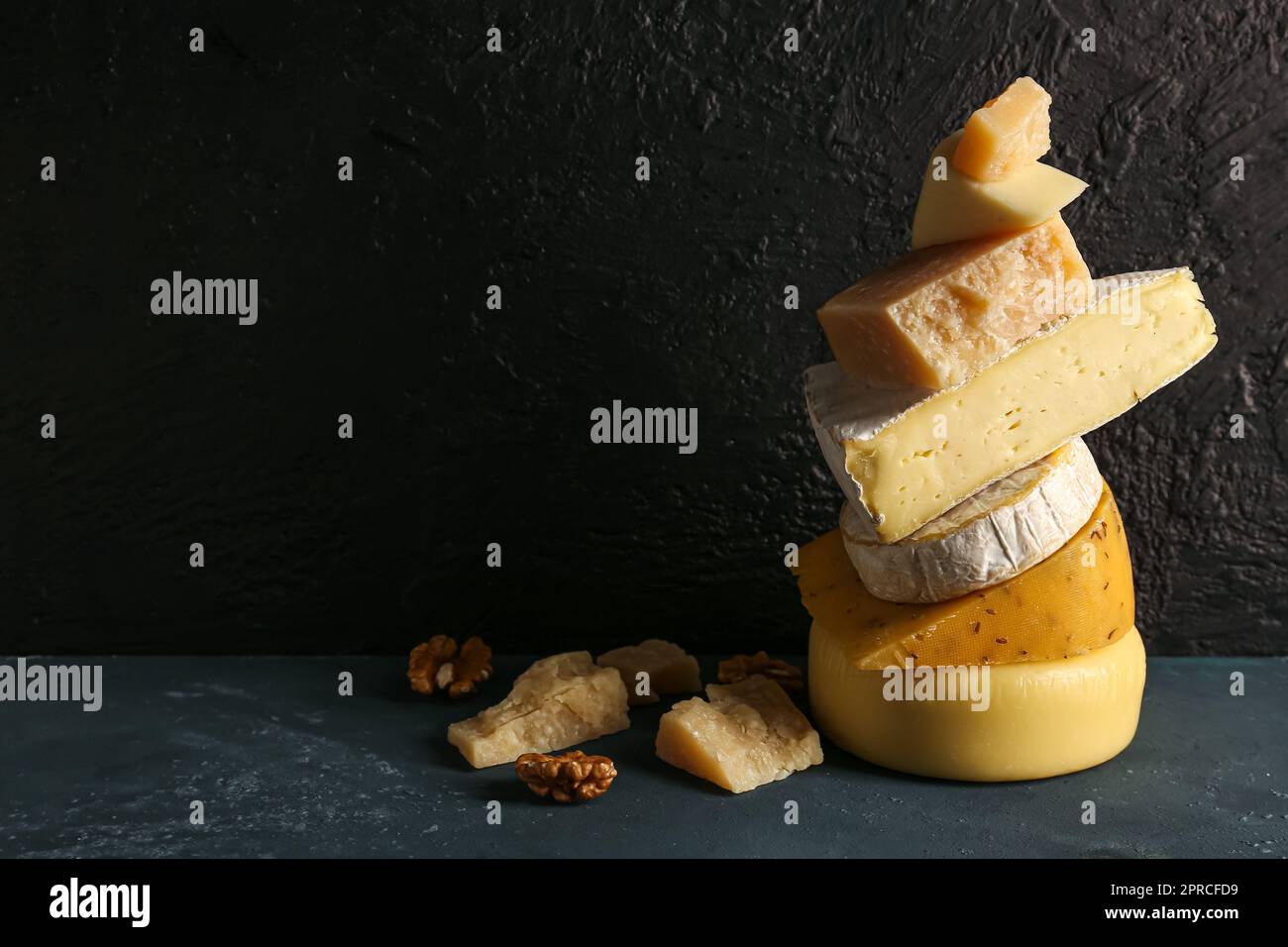 Different types of tasty cheese on table Stock Photo - Alamy