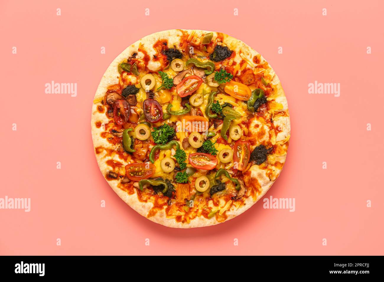 Vegetable pizza on pink background Stock Photo - Alamy
