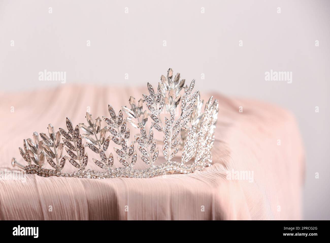 Beautiful tiara on prom dress, closeup Stock Photo - Alamy