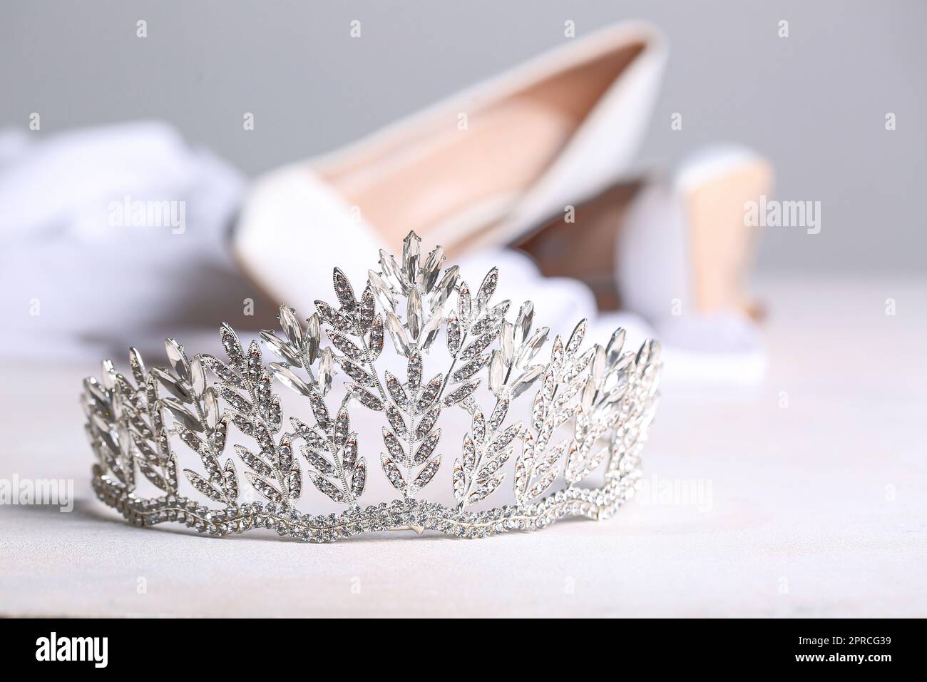Beautiful tiara on white table, closeup. Prom concept Stock Photo - Alamy