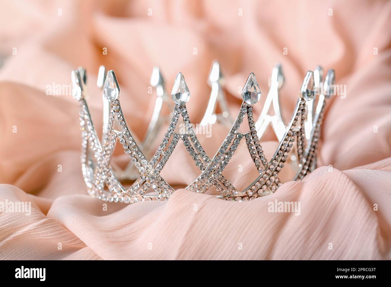 Beautiful crown on prom dress, closeup Stock Photo - Alamy