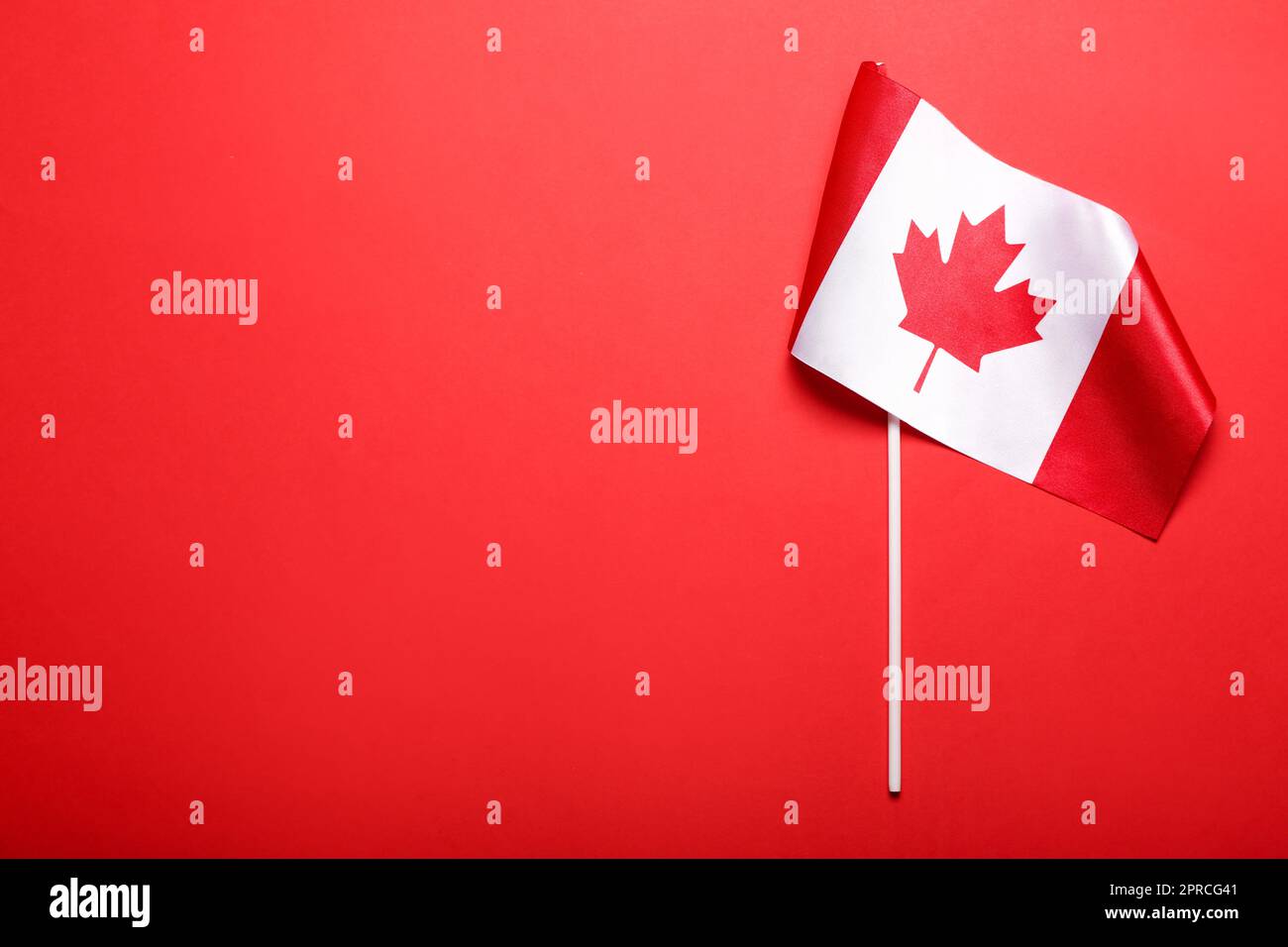 Flag of Canada on red background Stock Photo - Alamy
