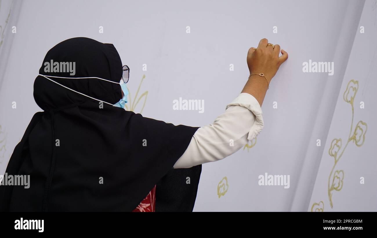 The process of making batik on Festival Batik Keren Blitar. Batik is a ...