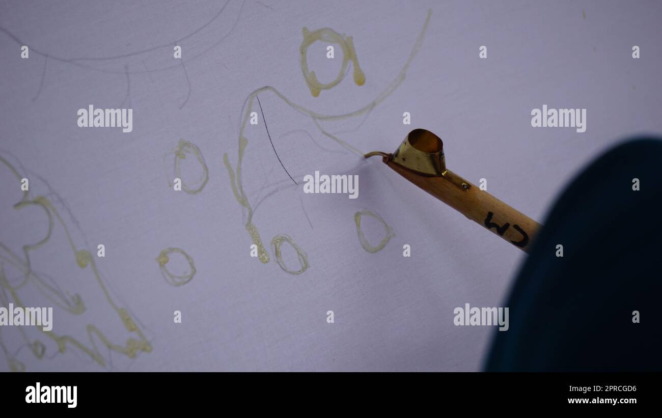 The process of making batik on Festival Batik Keren Blitar. Batik is a ...