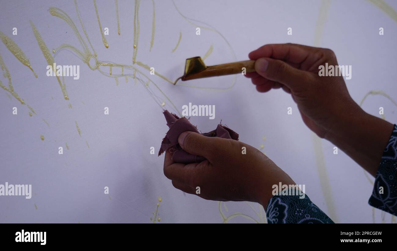 The process of making batik on Festival Batik Keren Blitar. Batik is a ...