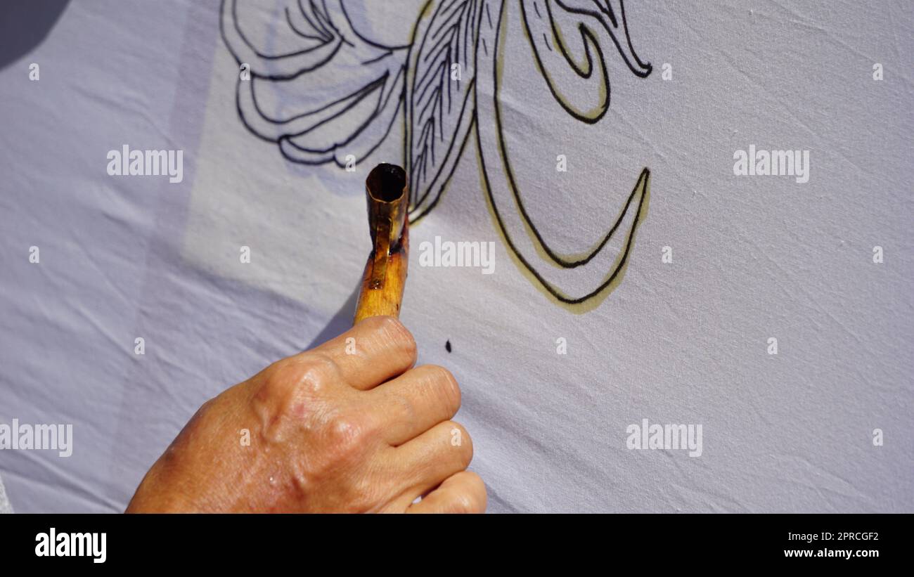 The process of making batik on Festival Batik Keren Blitar. Batik is a ...