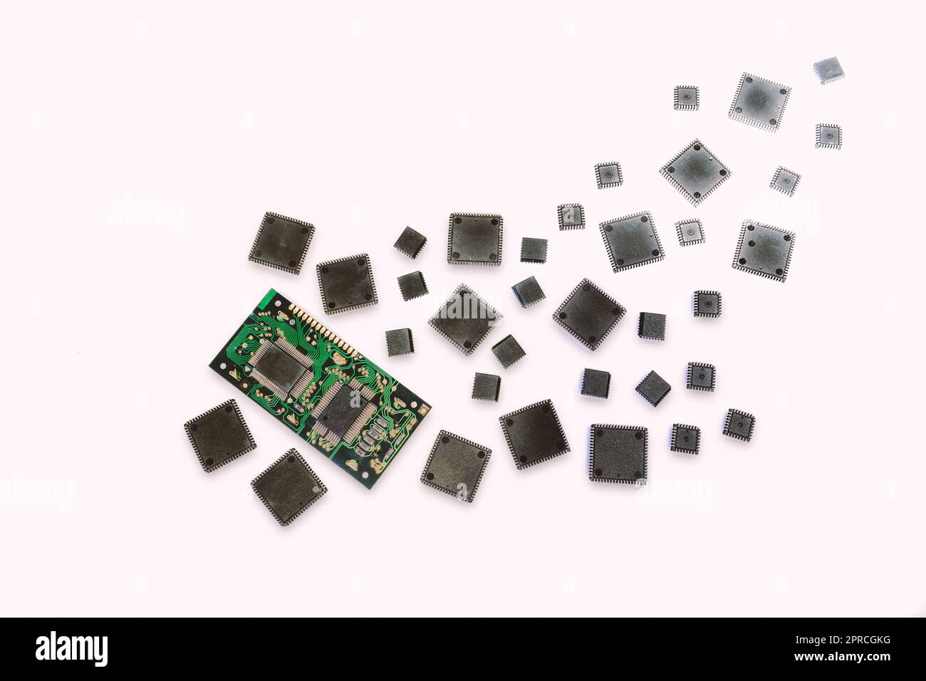 electronic components microchips and printed circuit board on white ...