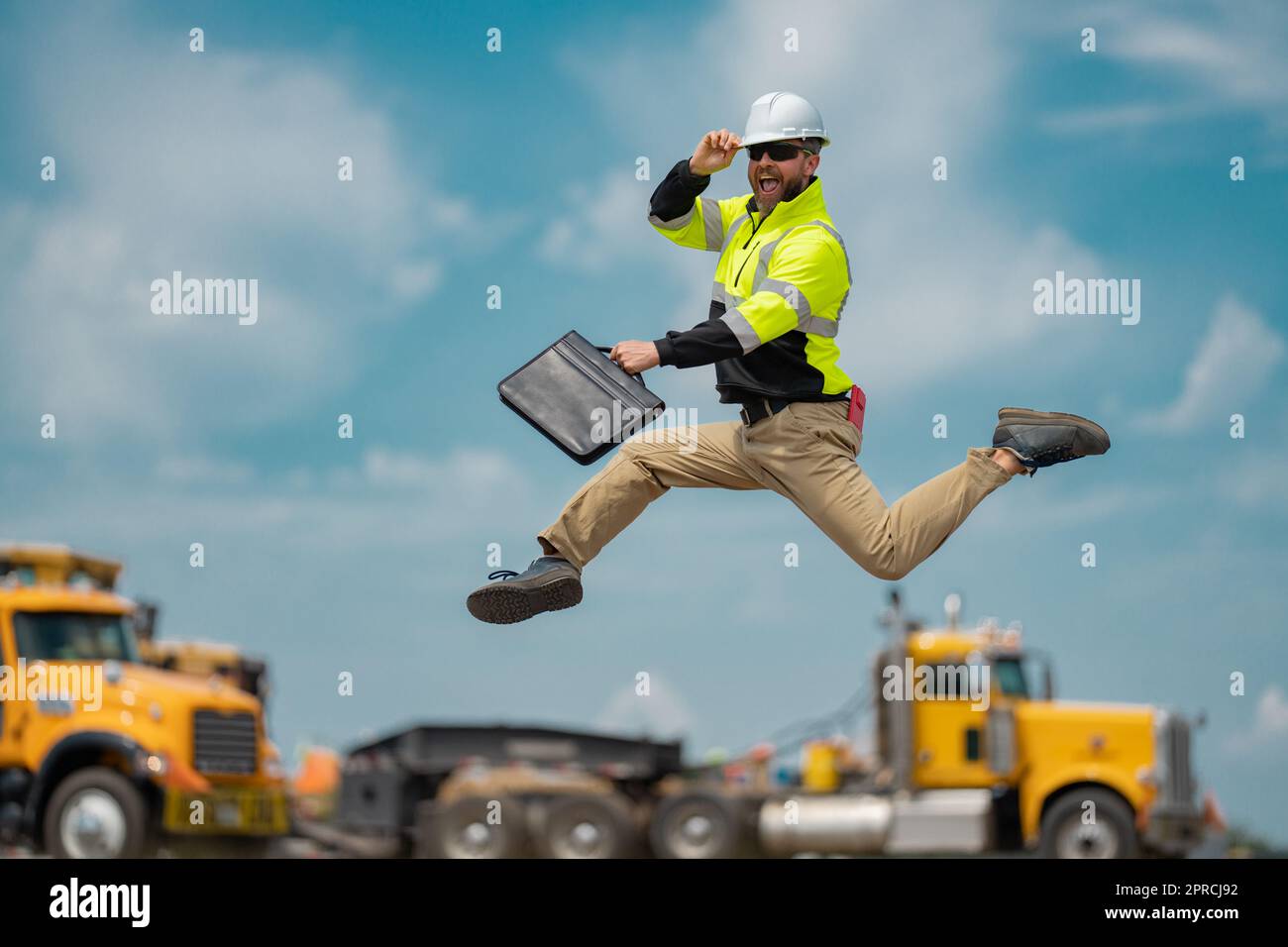 Hispanic builder excited jump and run on site construction. Excited ...