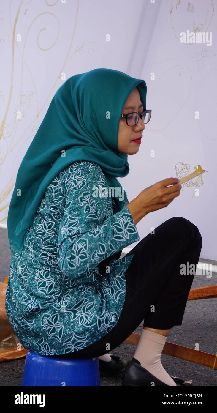 The process of making batik on Festival Batik Keren Blitar. Batik is a ...