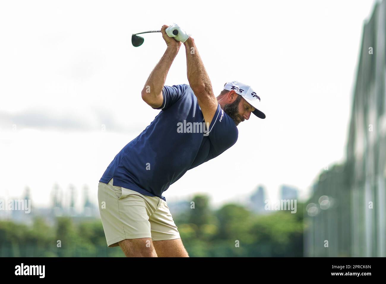 Captain Dustin Johnson of 4Aces GC hits on the driving range before the ...
