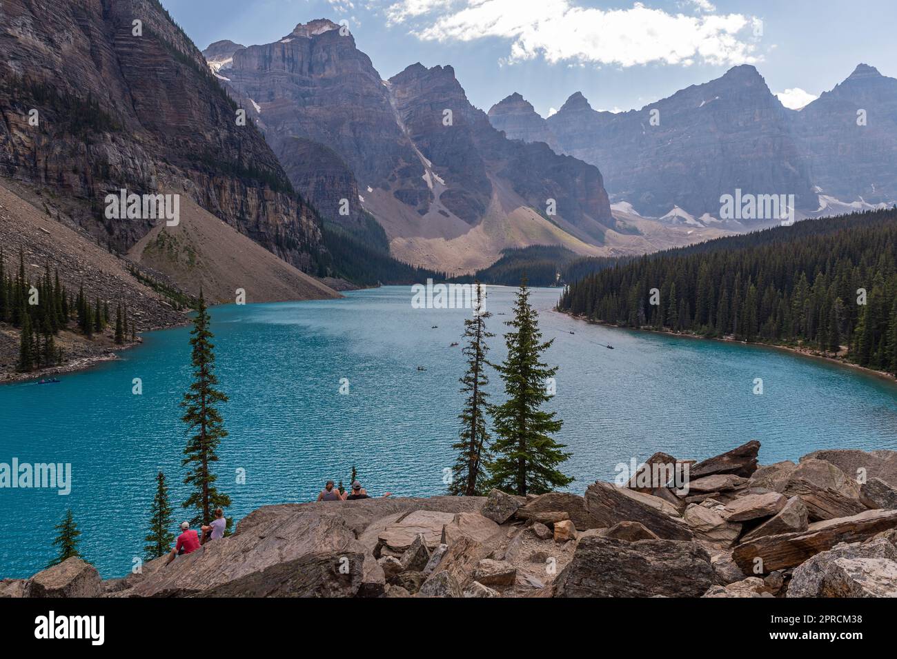 Moraine Lake and Valley of the Ten Peaks with people enjoying the view and doing kayak in summer ...