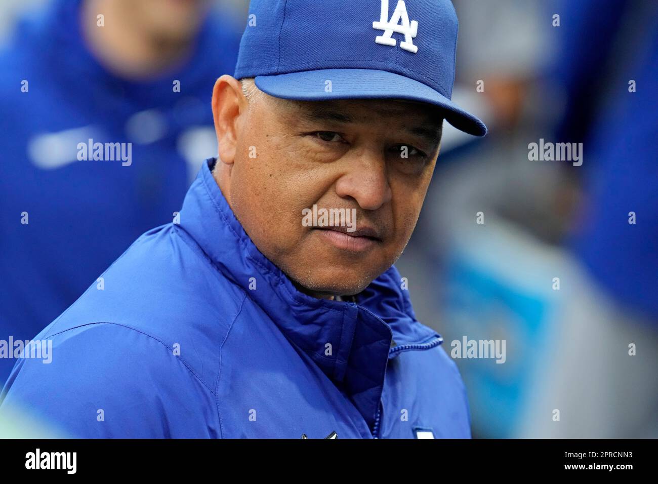 Los Angeles Dodgers manager Dave Roberts stands in the dugout before a ...
