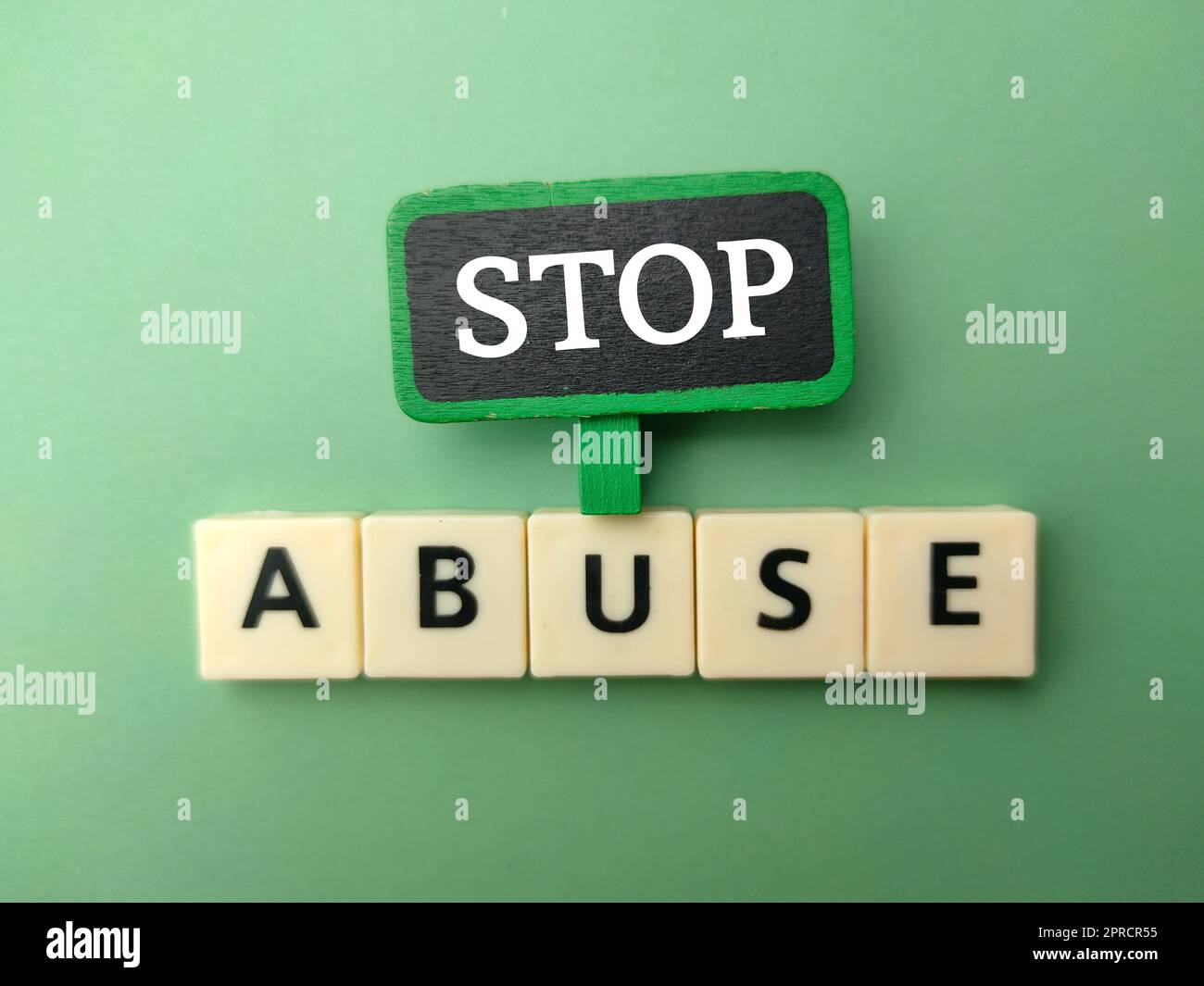 Colored board and toys word with the word STOP ABUSE Stock Photo - Alamy