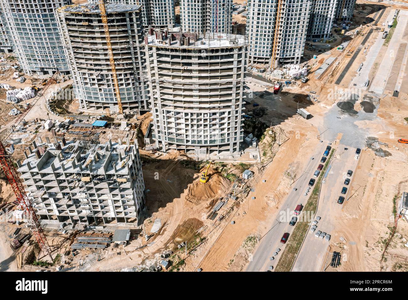 busy construction site. complex of high-rise apartment buildings under ...