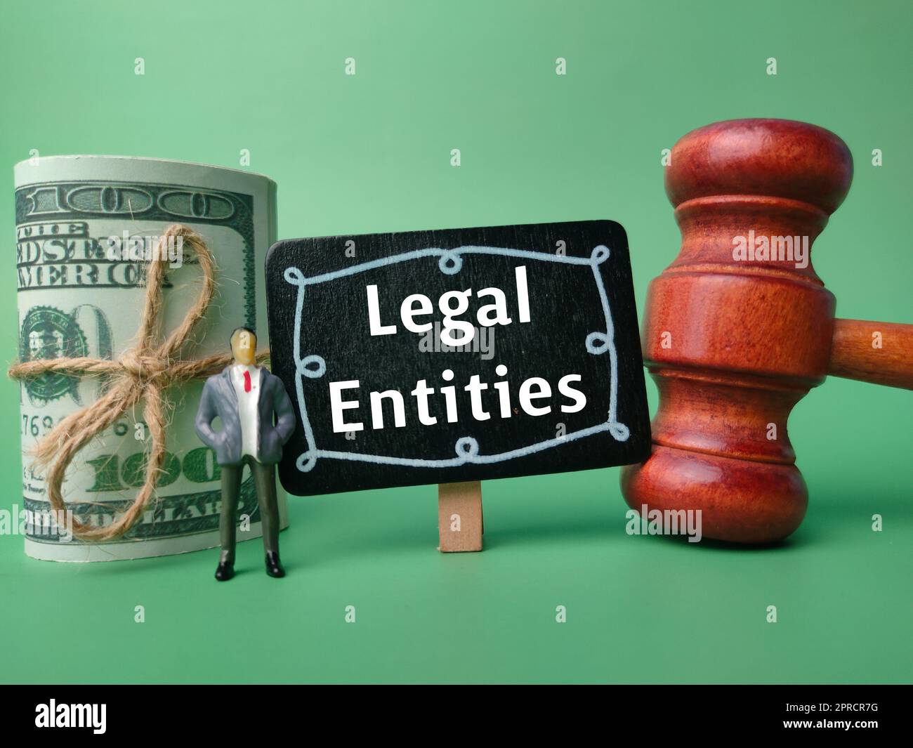 Gavel,banknotes,miniature people and wooden board with the word Legal ...
