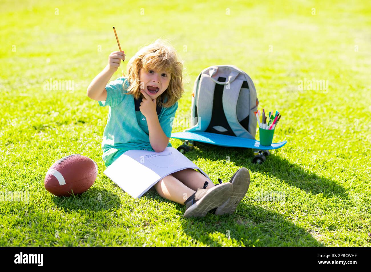 Child painter draw on playground. School kid drawing in summer park ...