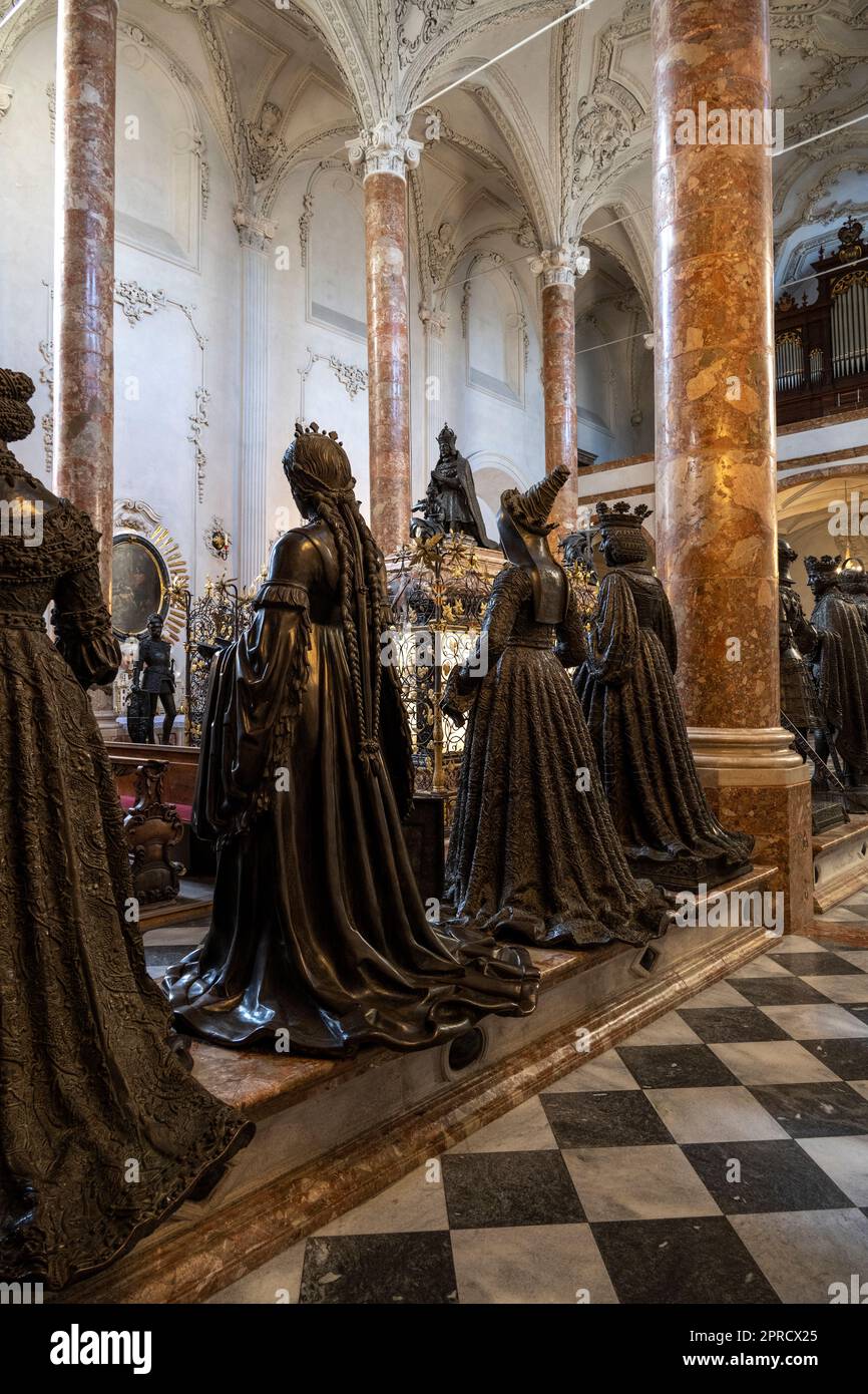 Bronze statues flank the the cenotaph of Maximilian I at the Hofkirche ...