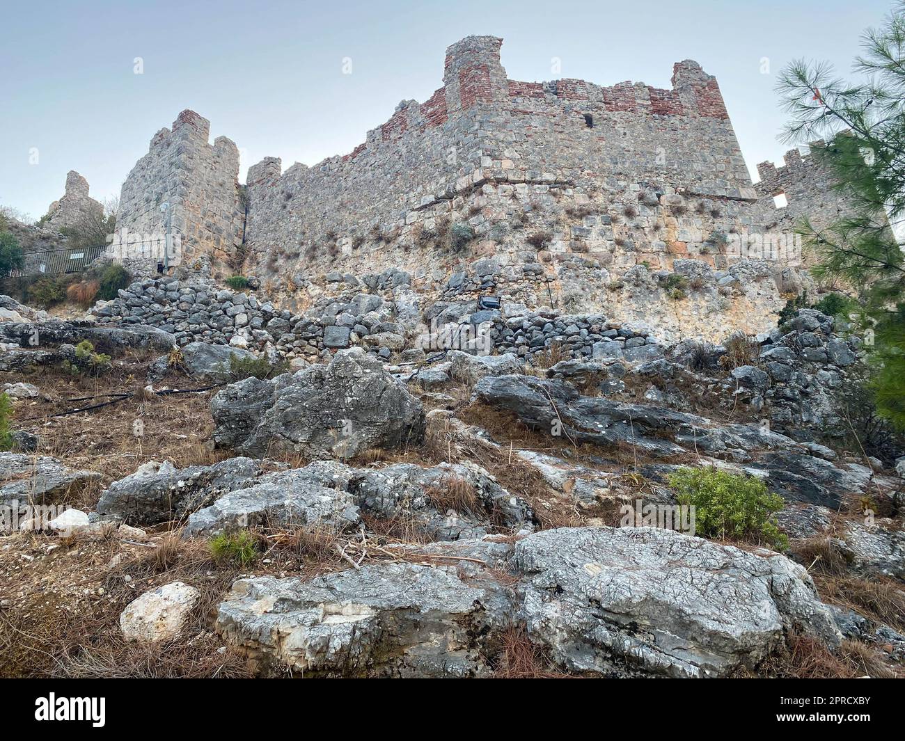 Ancient old medieval fortress, castle, hidden ruins made of stones in a ...