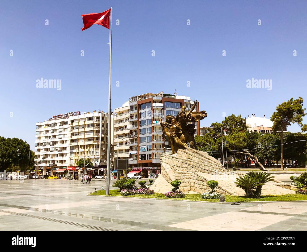 square in the city center with white houses. near the center is a red ...