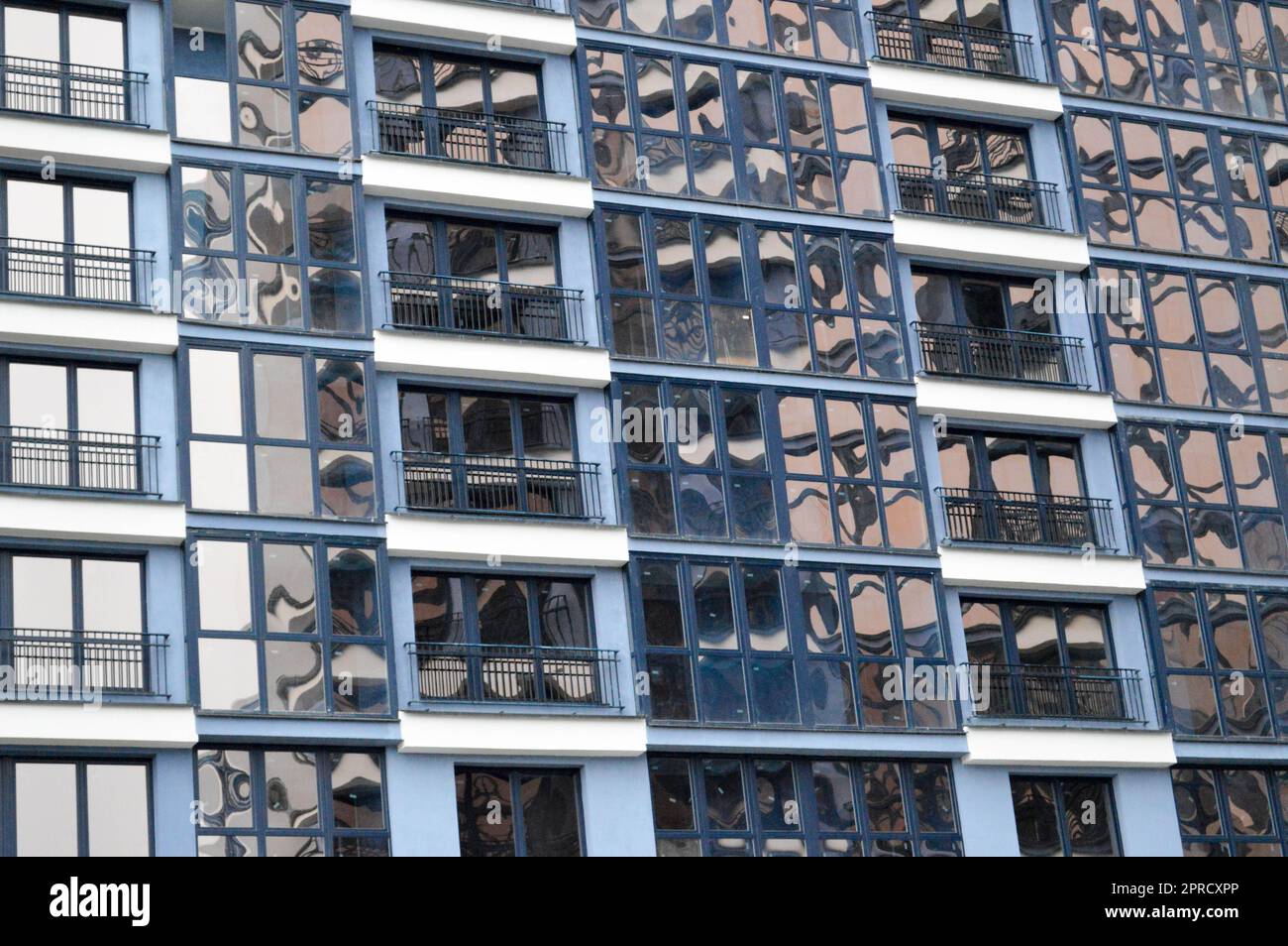 Beautiful modern blue glass fiberglass windows of the facade wall of a ...