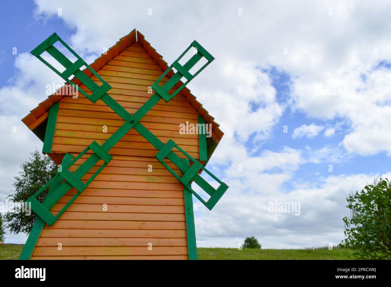 A beautiful wooden mill is a rustic natural windmill made of boards of ...