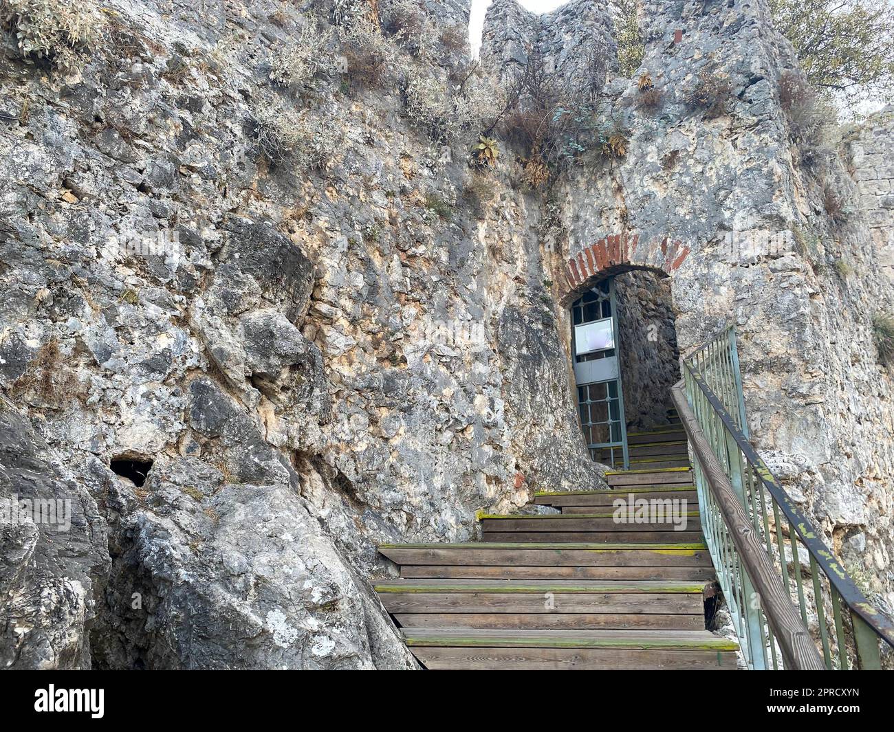 Passage, doorway, archway in an old ancient medieval fortress made of ...