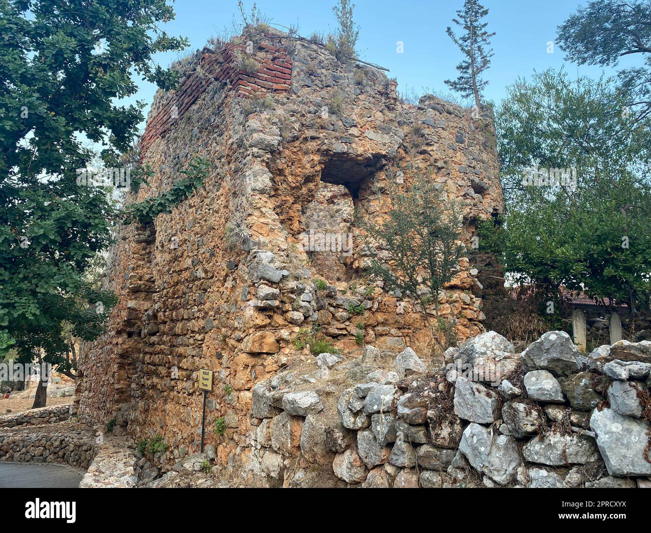 The ruins of an ancient old broken ruined medieval fortress made of ...