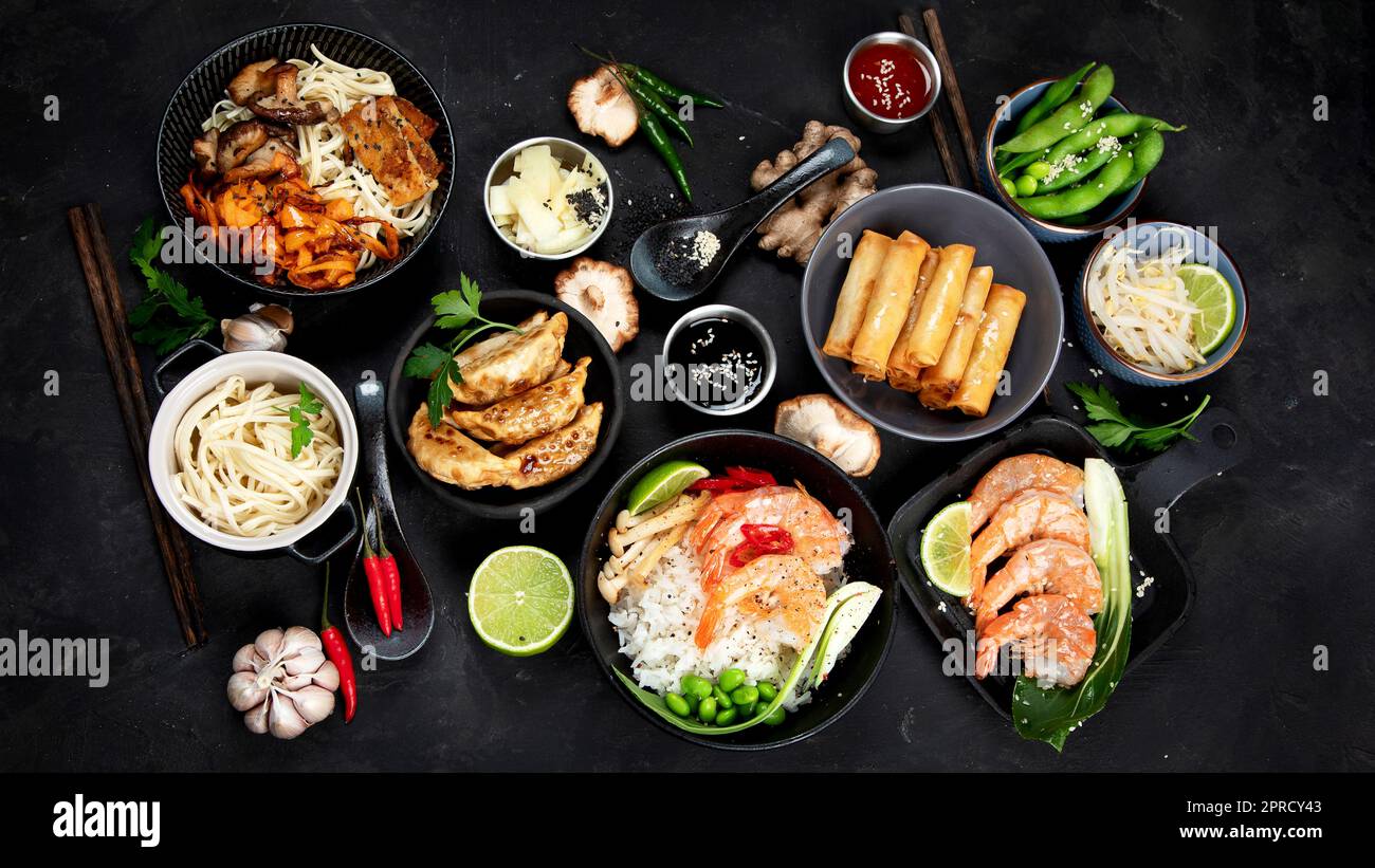 Various asian meals dishes on black background , top view. Asian food ...
