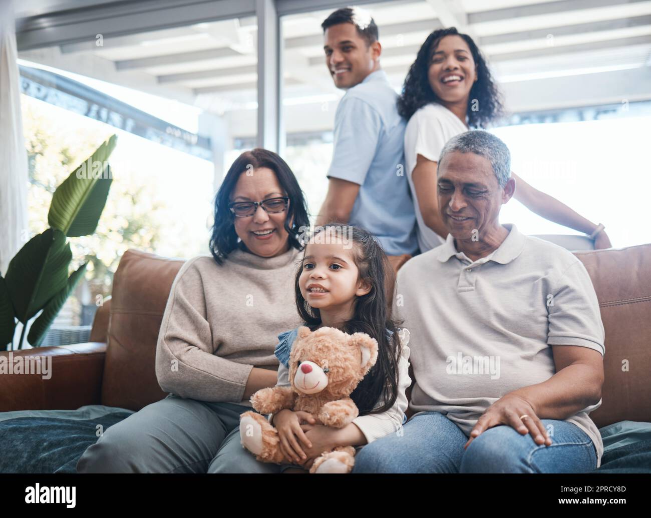 Big family, house and sofa with grandparents, kid smile and happiness ...