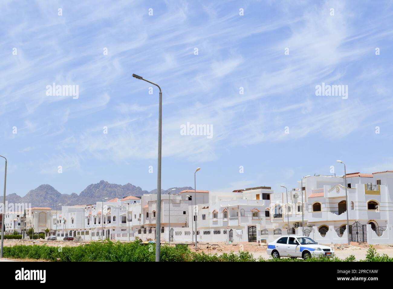 City landscape with white small square houses, cottages and townhouses ...