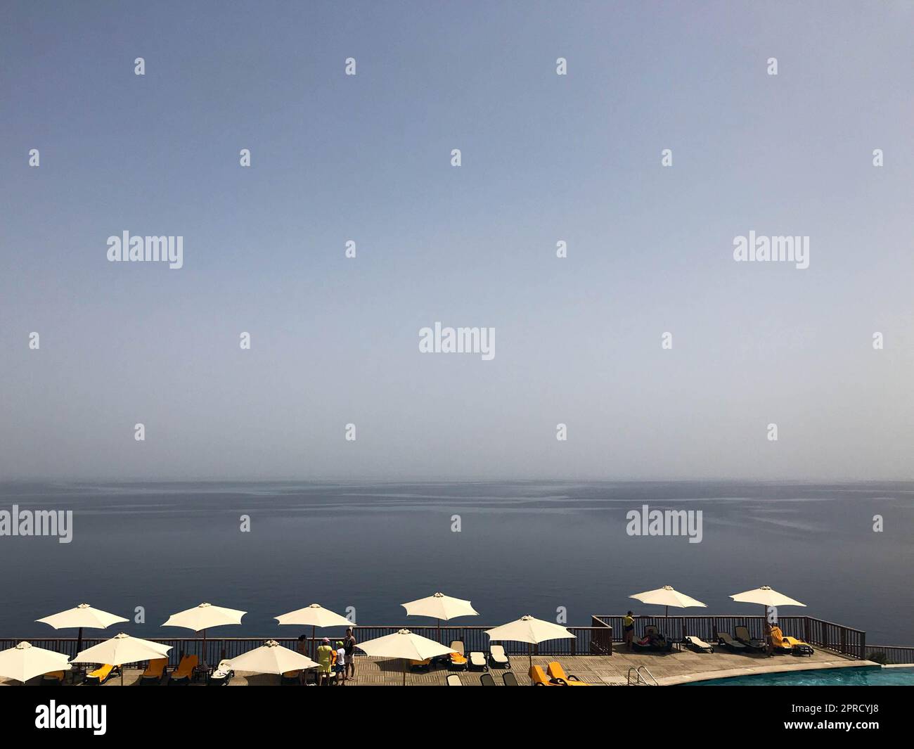 Sunshine sun umbrellas at the hotel in a tropical exotic resort, spa on ...