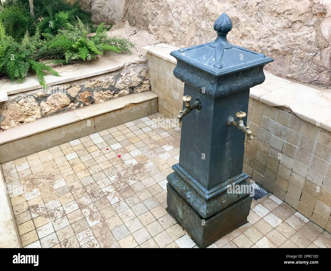 Black iron carved forged fountain with three beautiful textured faucets ...