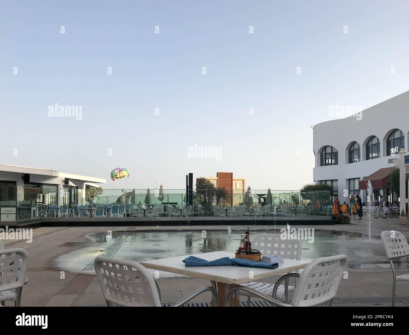 Open cafe in the street in the open air with tables, chairs and a ...