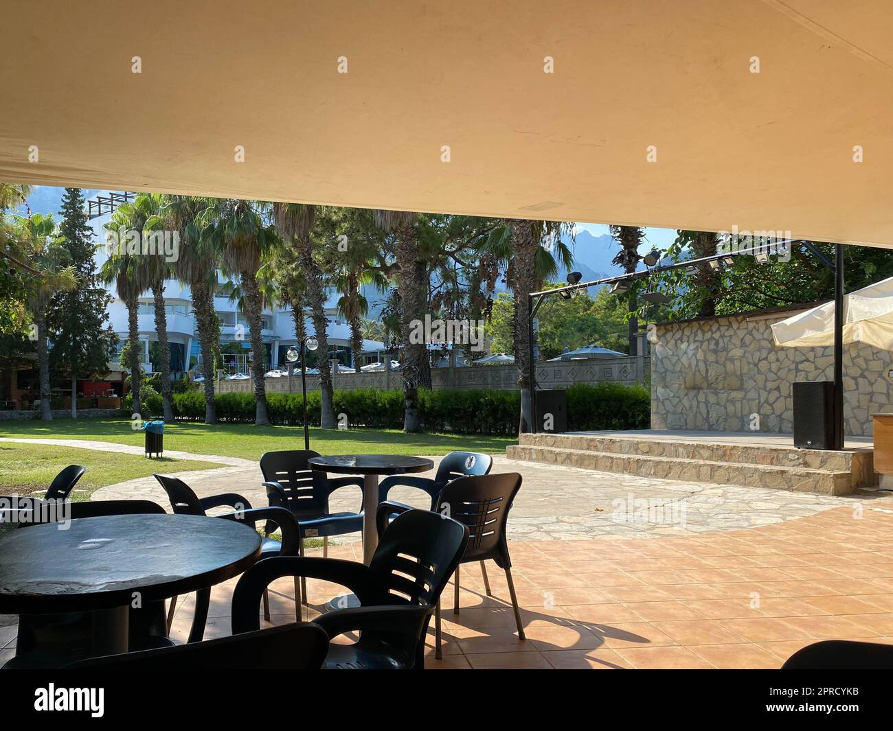 Summer outdoor stage. Summer terrace with tables and chairs, stage for ...