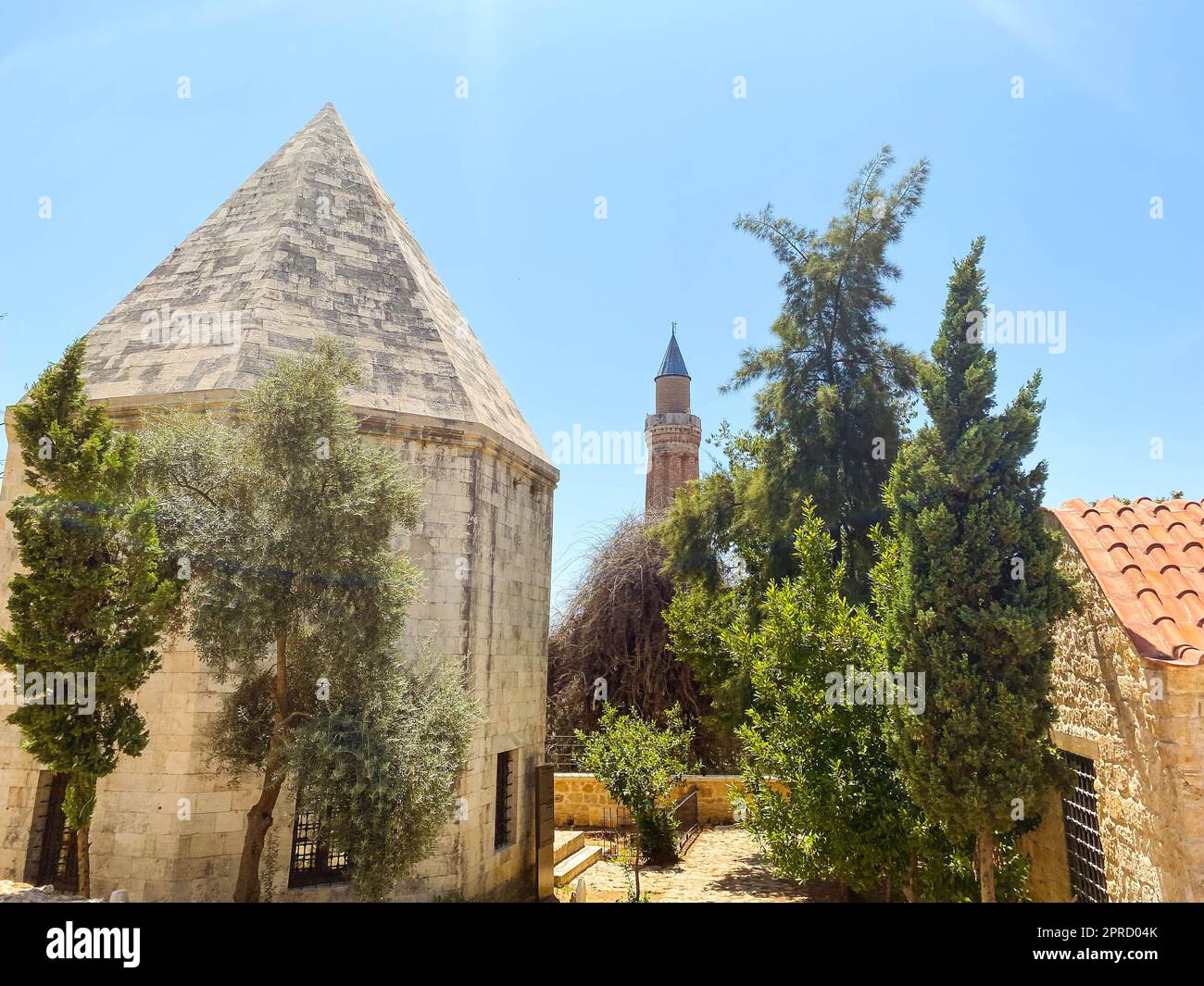 clay building with a pointed roof. house with domes and spire. living ...