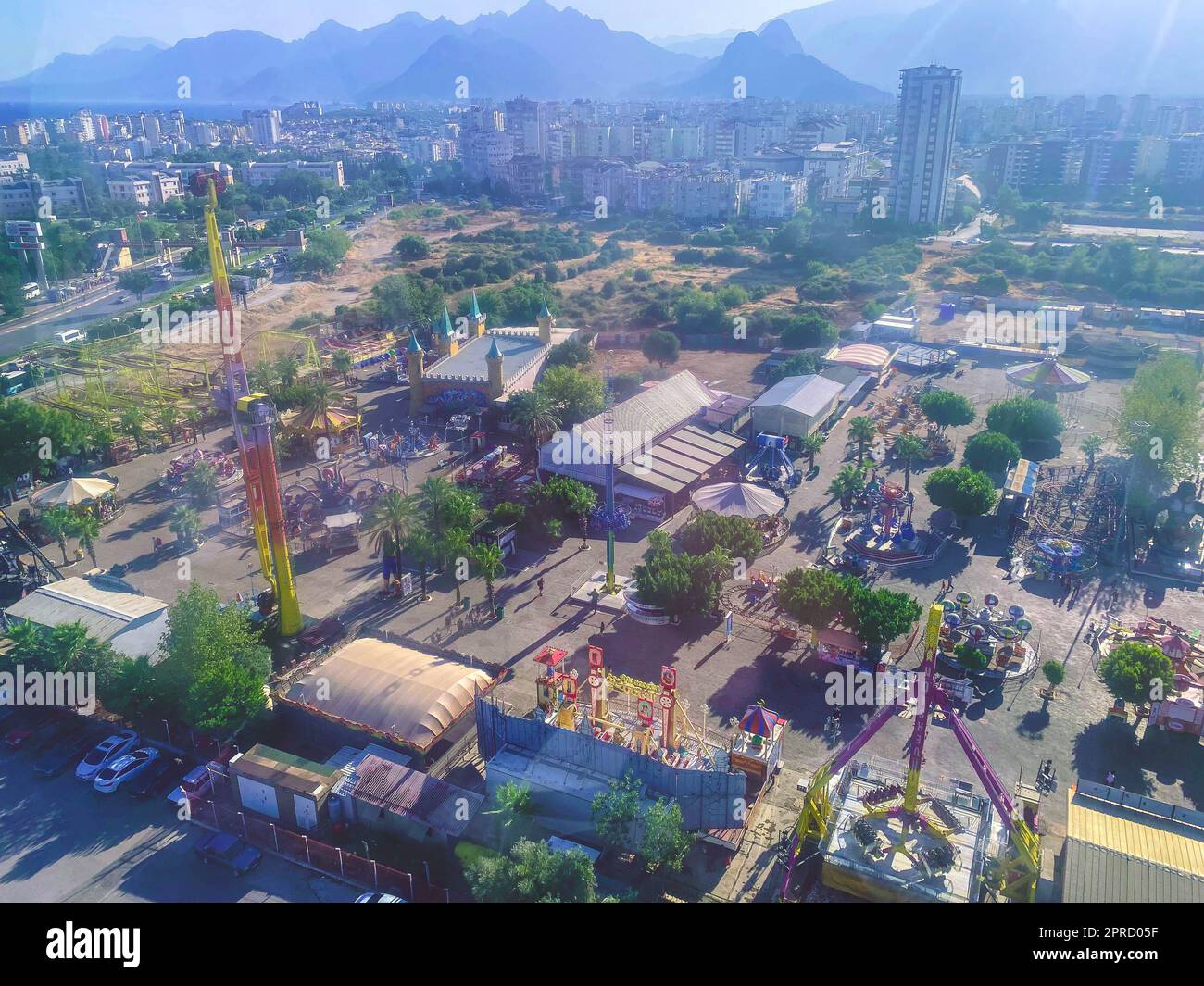Panoramic view of the city through the glass. Riding tourists on a ...