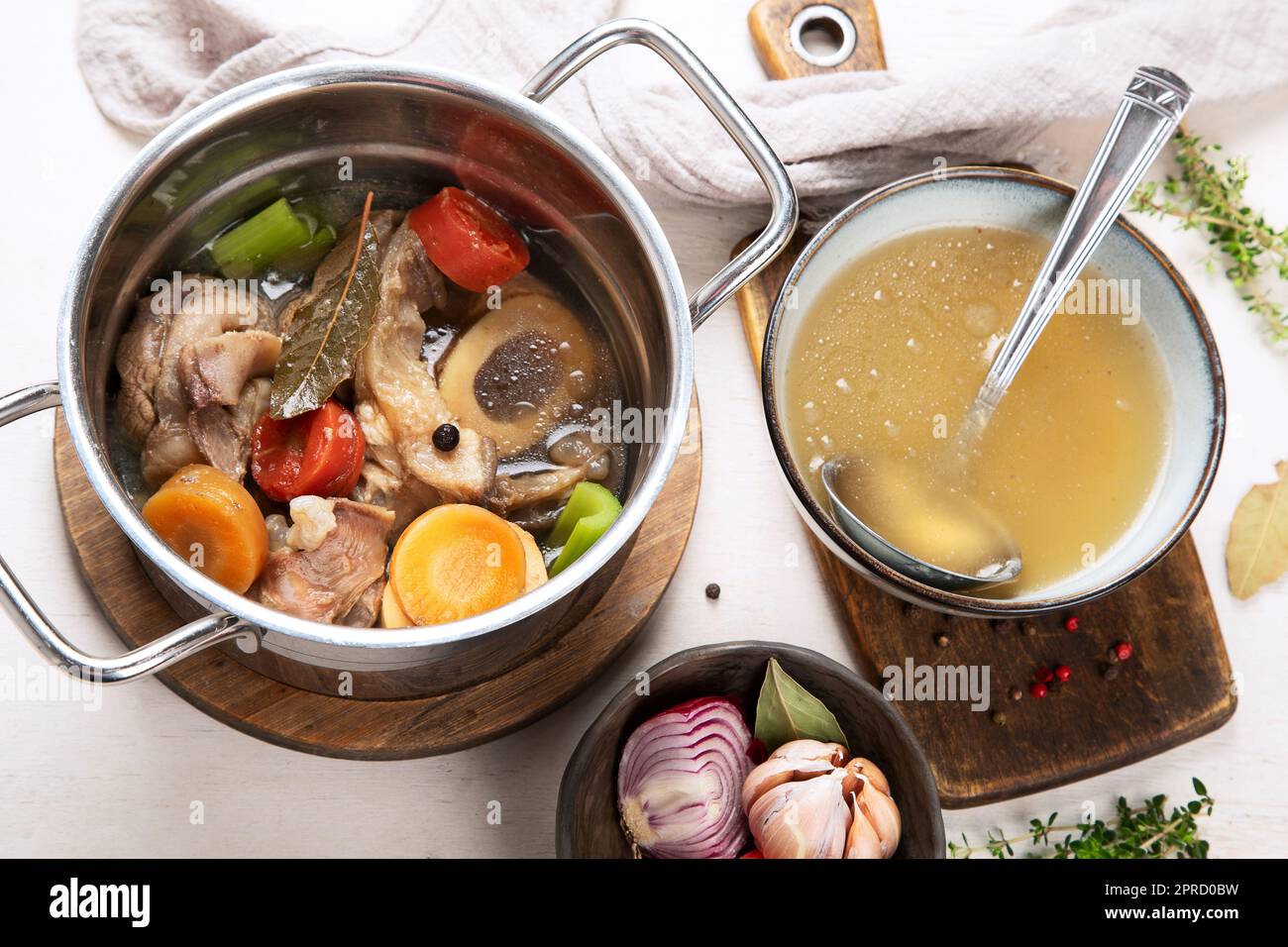 Beef broth of beef meat on bones slow cooked with vegetables: carrot ...