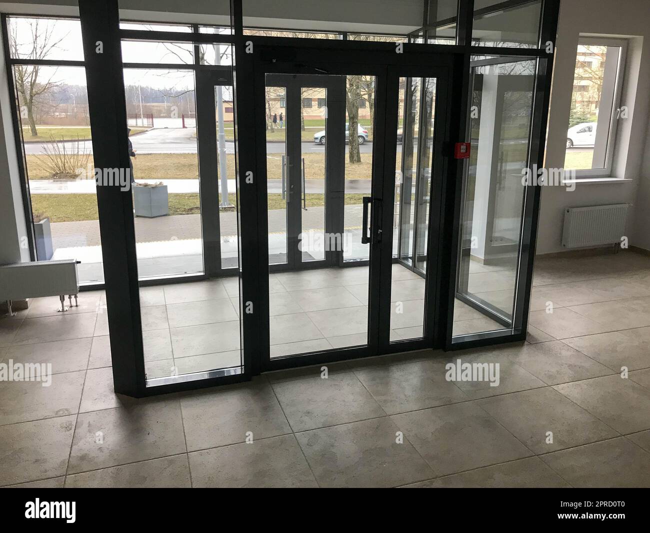 The glass entrance at the entrance to the building store office with ...