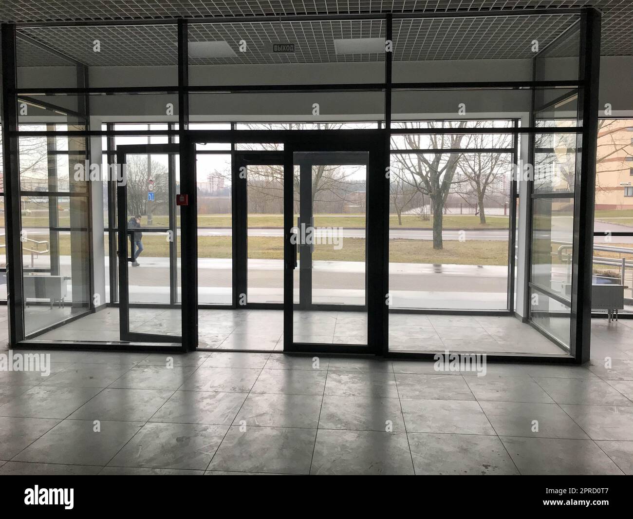 The glass entrance at the entrance to the building store office with ...